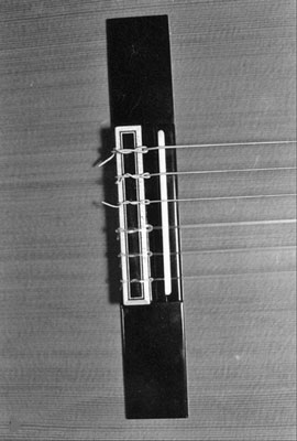 How to Attach a Nylon String to the Bridge of an Acoustic Guitar - dummies