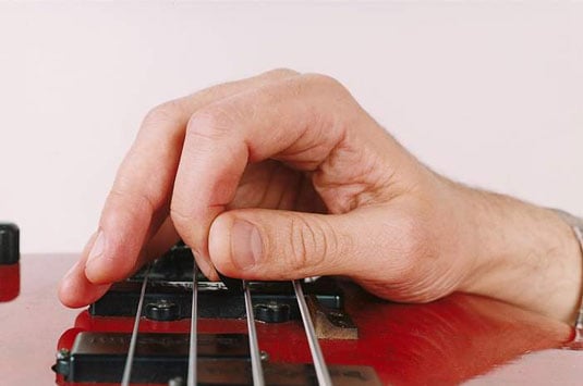 How to Position Your Right Hand on a Bass Guitar for Pick-Style Playing ...
